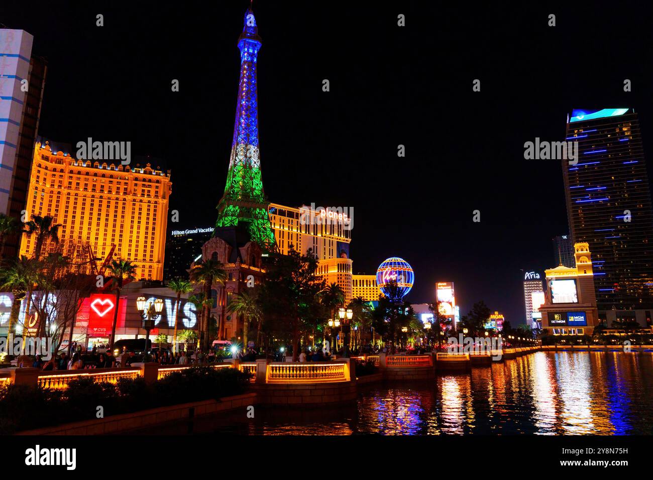 Las Vegas, Nevada - April 13, 2024: Brightly lit Las Vegas Strip featuring Eiffel Tower replica ...