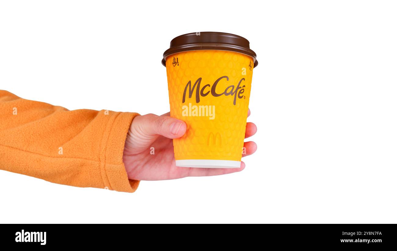 Kyiv, Ukraine - September 24, 2024: Hand presenting McDonald's McCafé ...