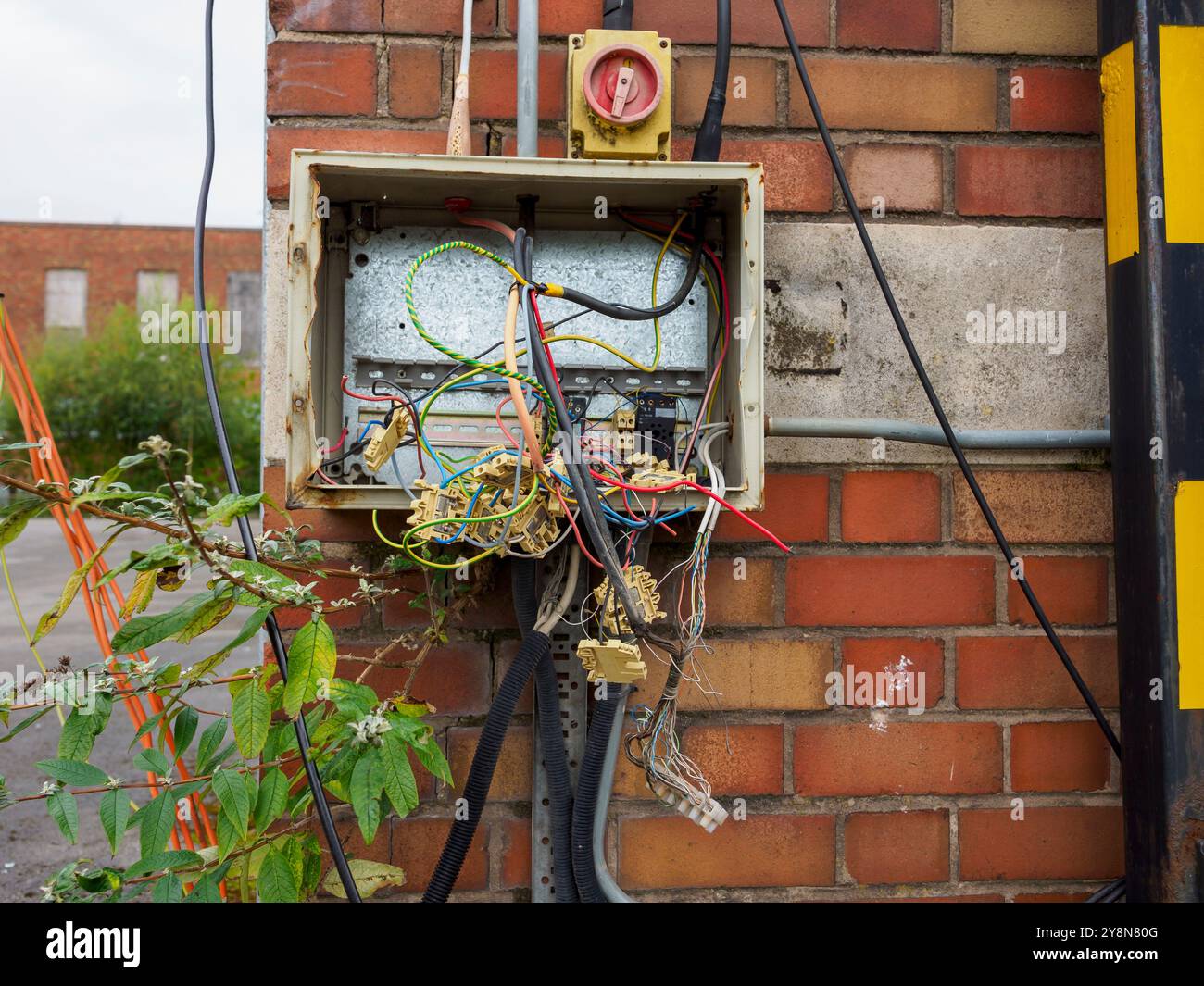 Exposed and tangled electrical wiring in an outdoor utility box on a ...
