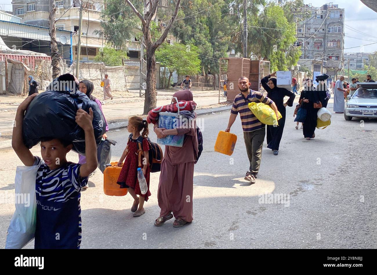 Residents flee to places they deem safe with the belongings they can ...