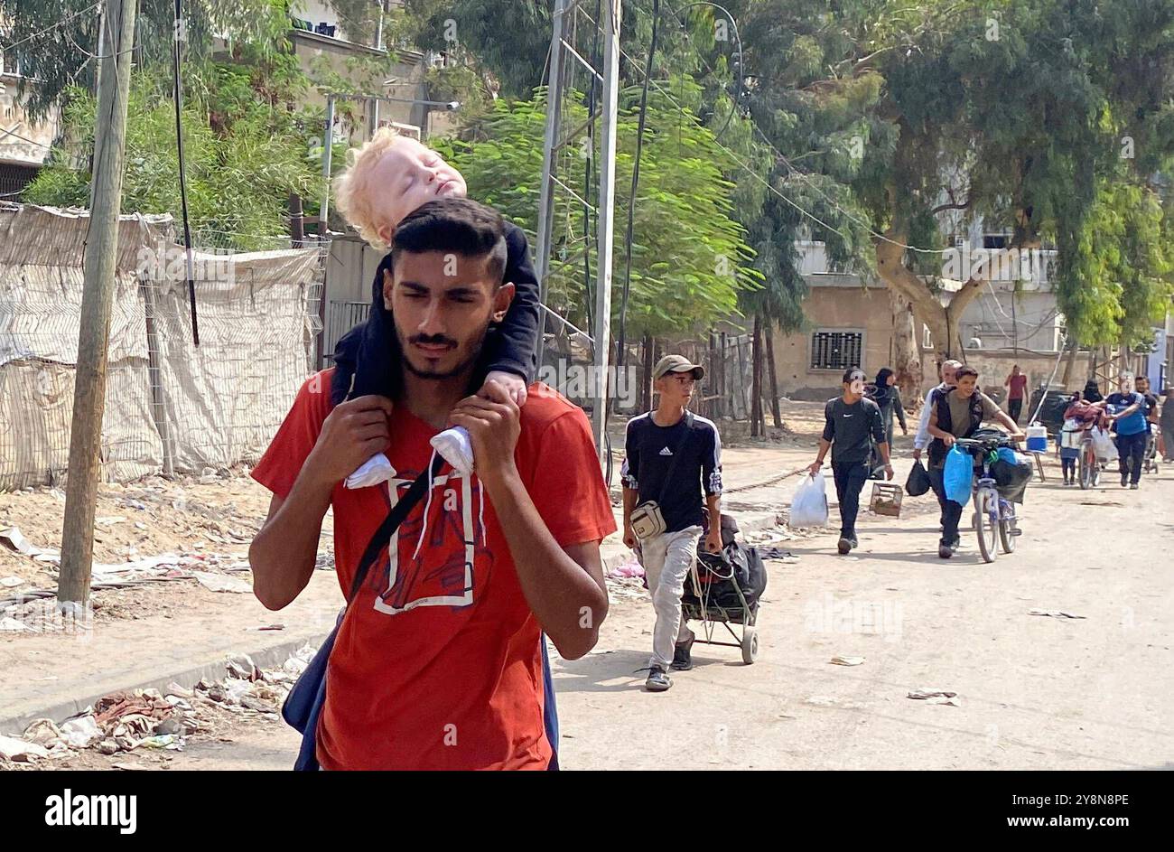 Residents flee to places they deem safe with the belongings they can ...