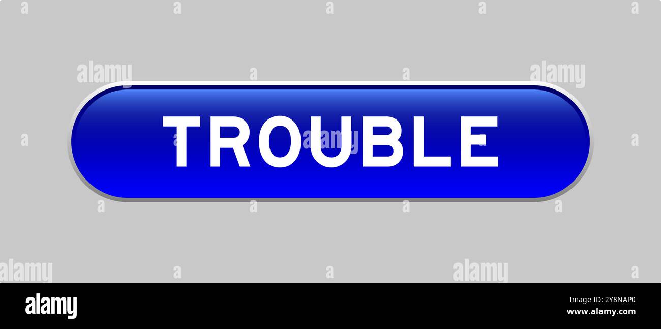 Blue color capsule shape button with word trouble on gray background ...
