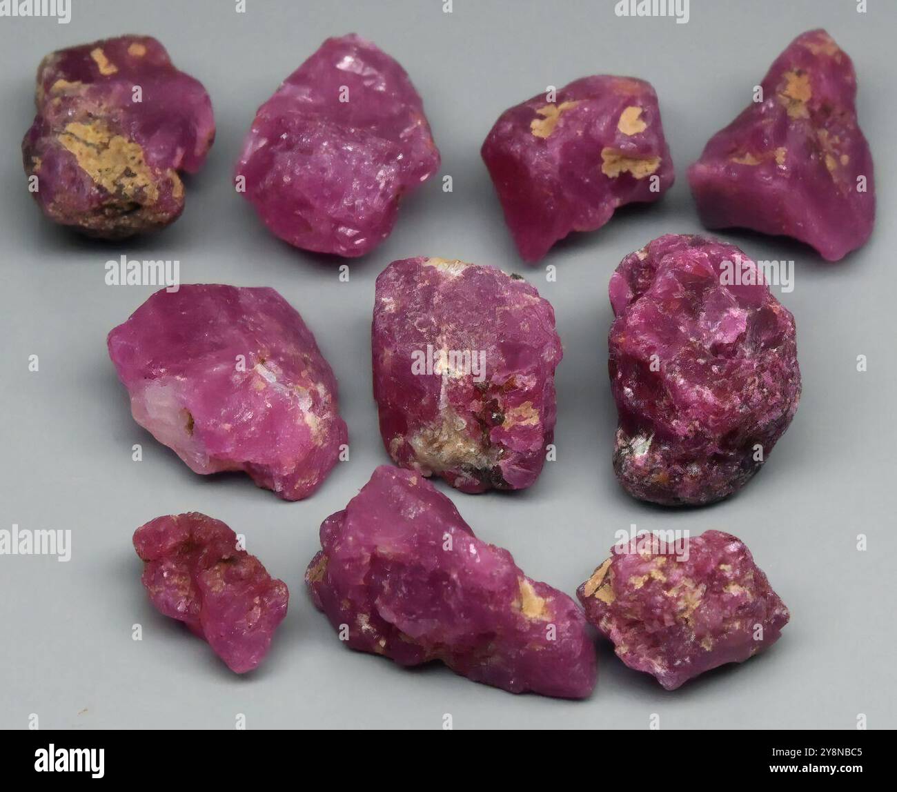 Exquisite Collection of Raw Rubies Showcasing Vivid Pink Hues and ...