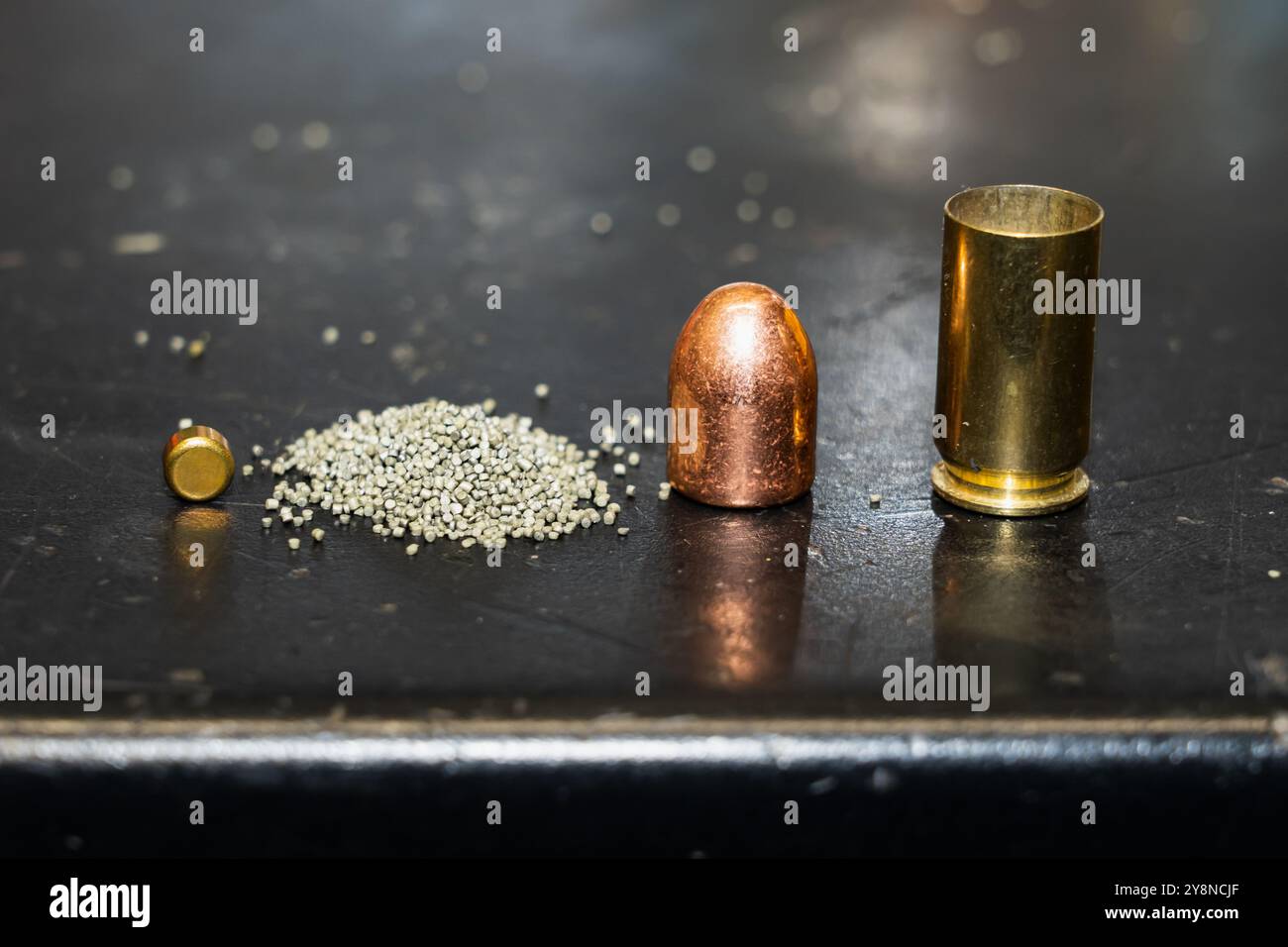 Disassembled pistol 45 caliber cartridge, bullet, case, gunpowder and ...