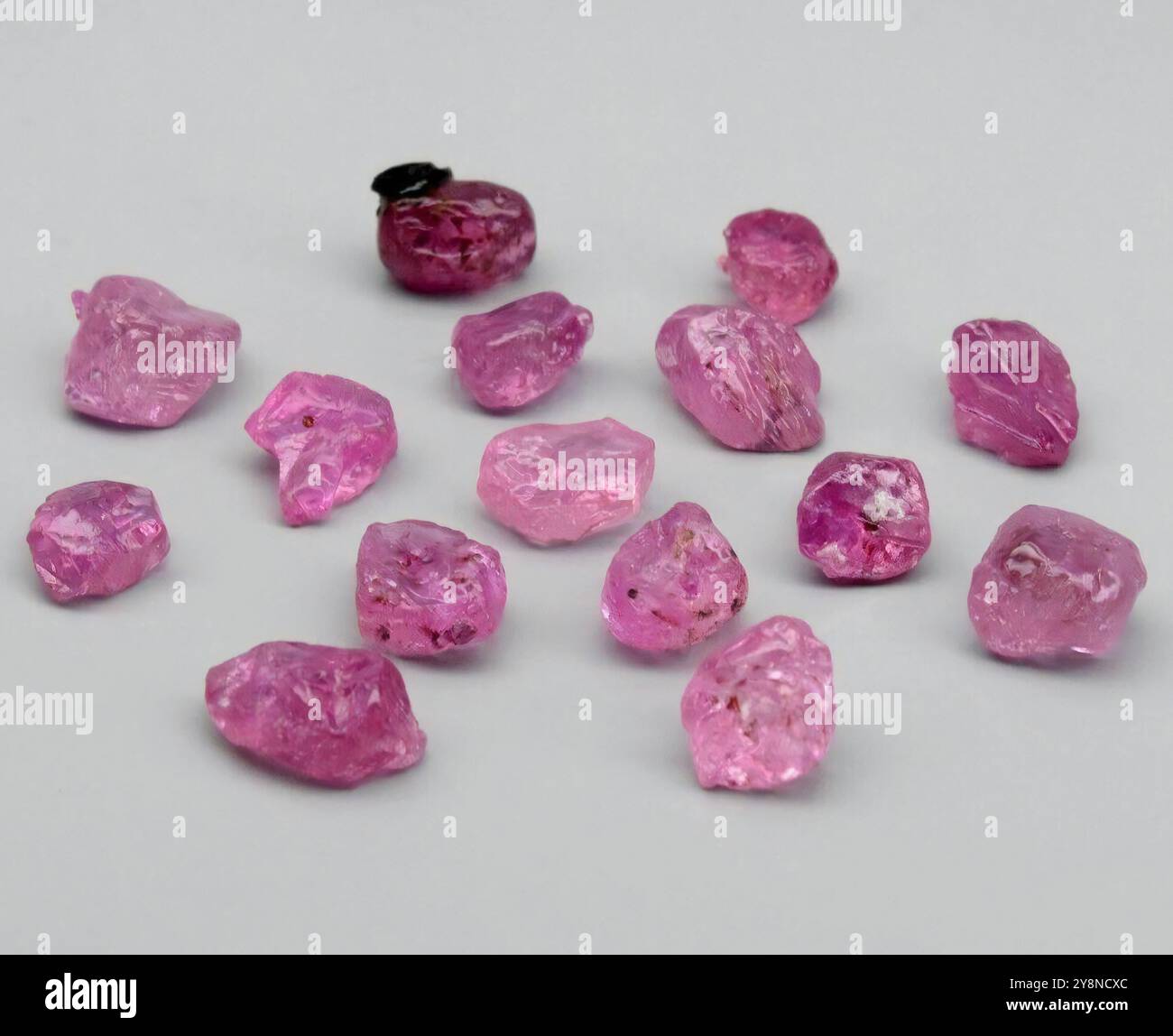 A Spectrum of Natural Pink Gemstones Showcasing Unique Shapes and ...