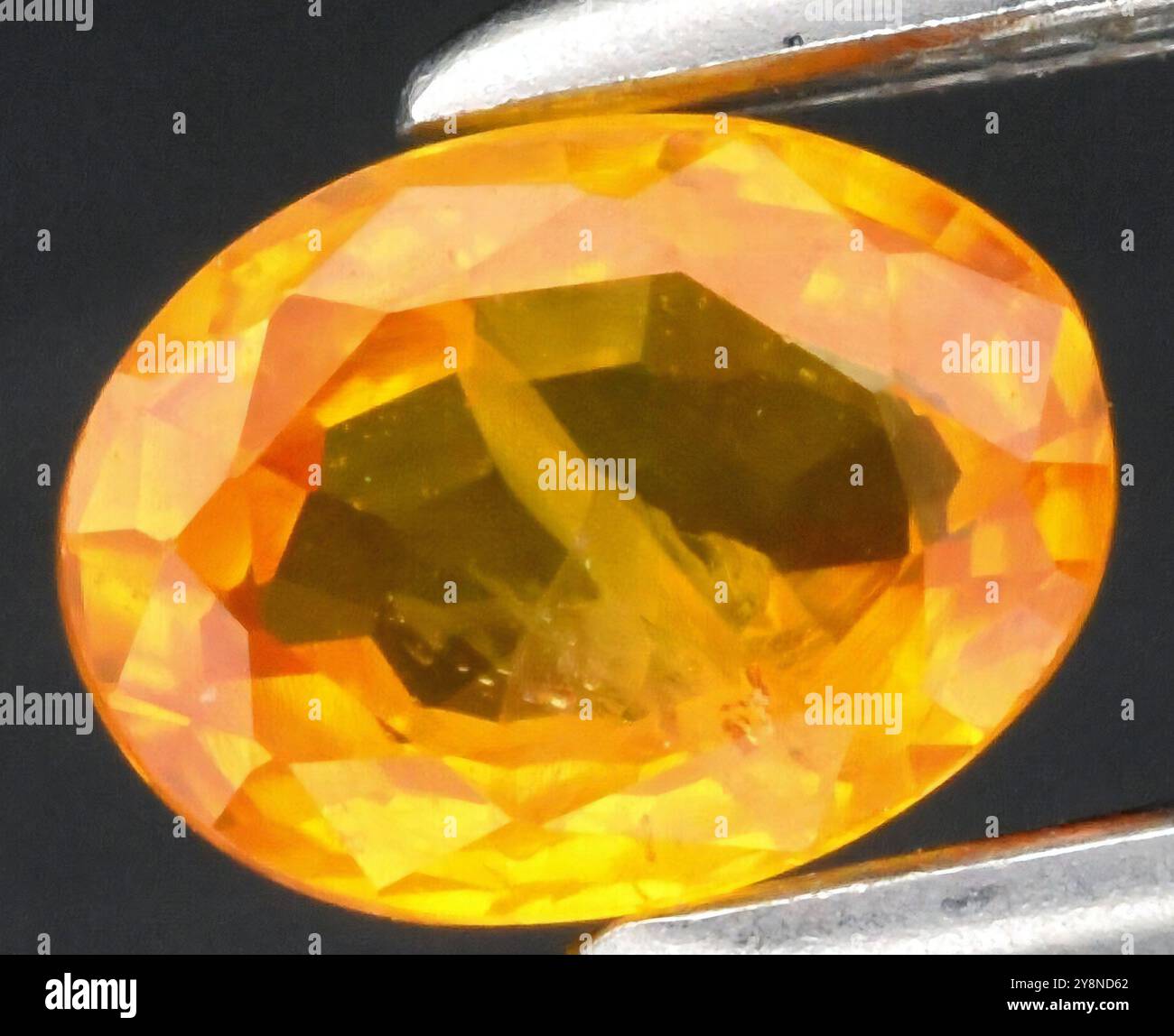 Exquisite Natural Yellow Orange Gemstone with Intricate Faceting and ...