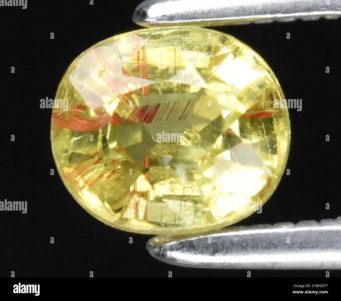 Exquisite Natural Yellow Gemstone with Reddish Inclusions Captured ...