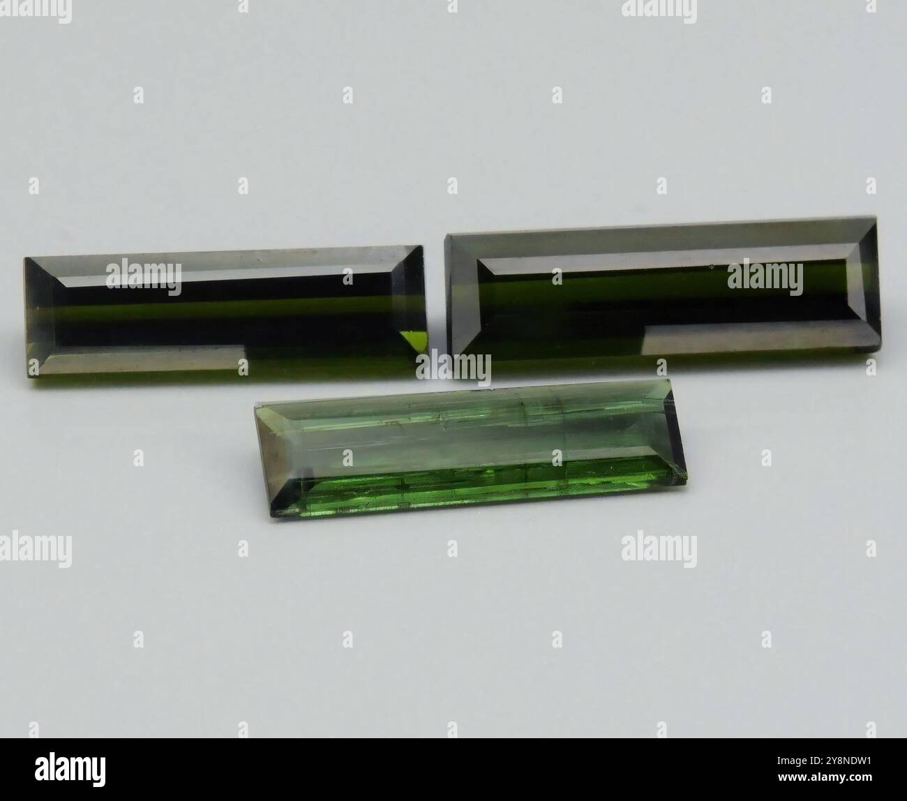 Elegant Arrangement of Triangular Natural Green Tourmaline Gemstones ...