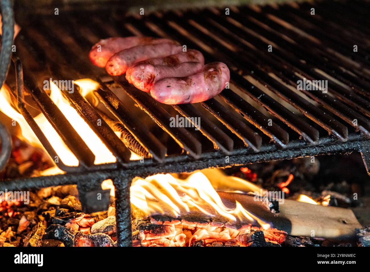 Classic Brazilian sausage barbecue on the grill with wood fire Stock ...