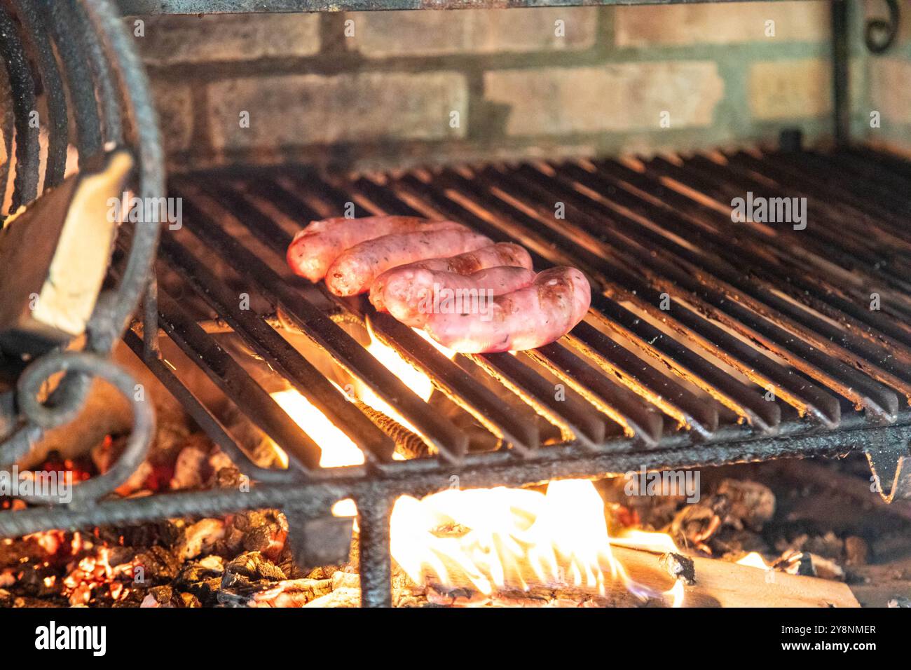 Classic Brazilian sausage barbecue on the grill with wood fire Stock ...