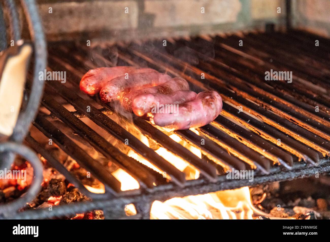 Classic Brazilian sausage barbecue on the grill with wood fire Stock ...