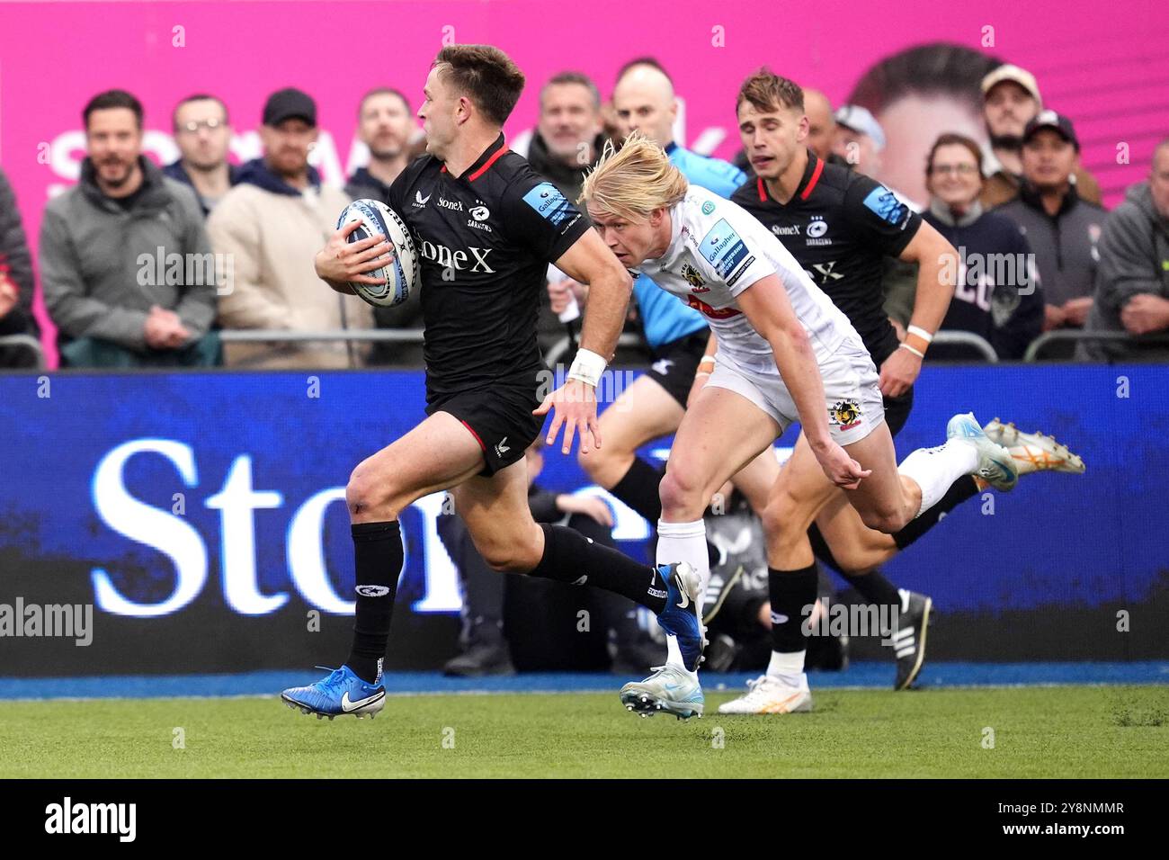 Saracens's Fergus Burke (left) on his way to scoring his side's fourth ...