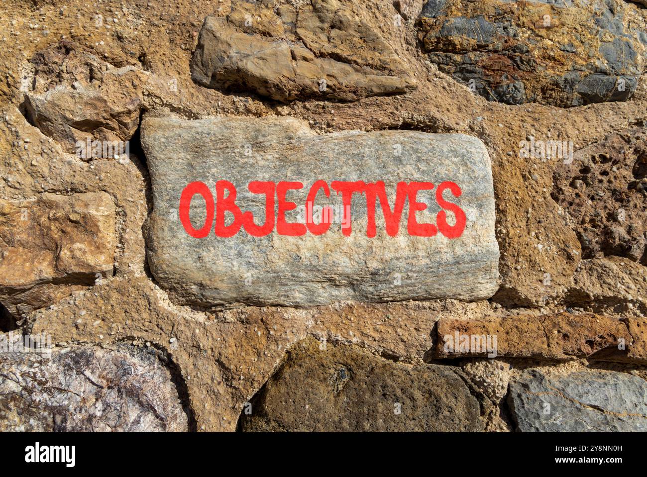 Objectives symbol. Concept word Objectives on beautiful grey volcanic ...