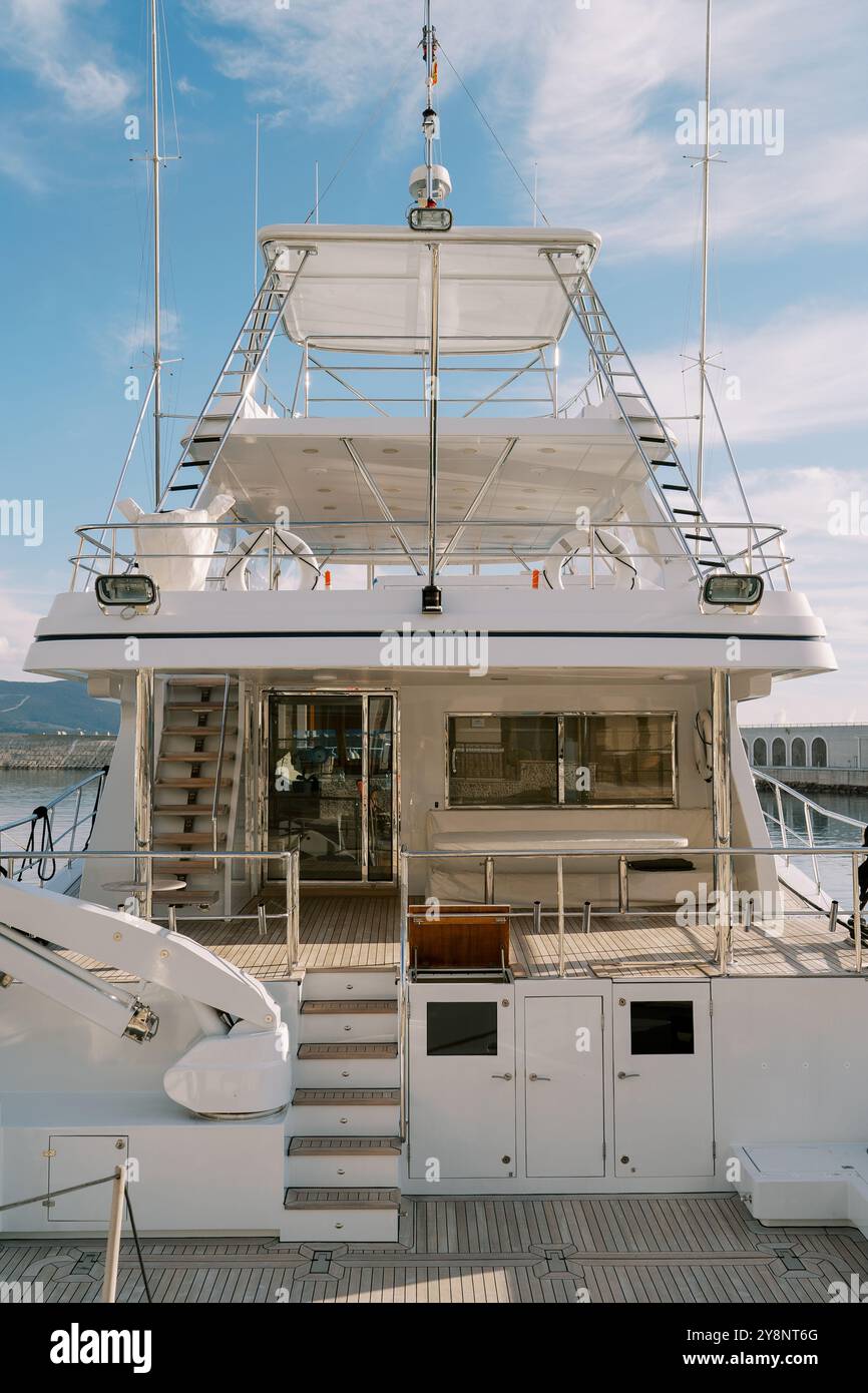Steps aboard a white double-deck yacht Stock Photo - Alamy