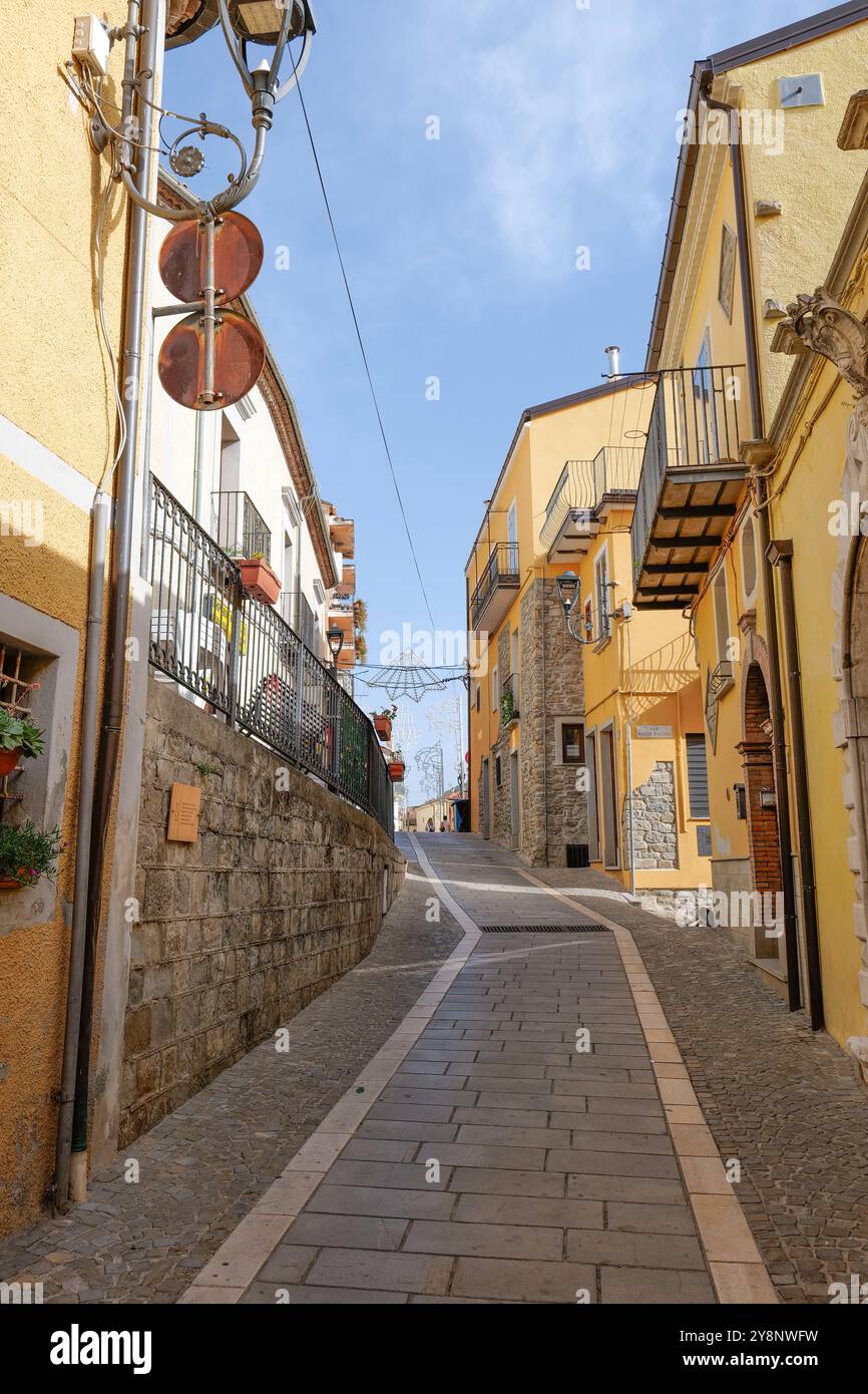 A narrow street between old herd houses, a small town in Basilicata in ...