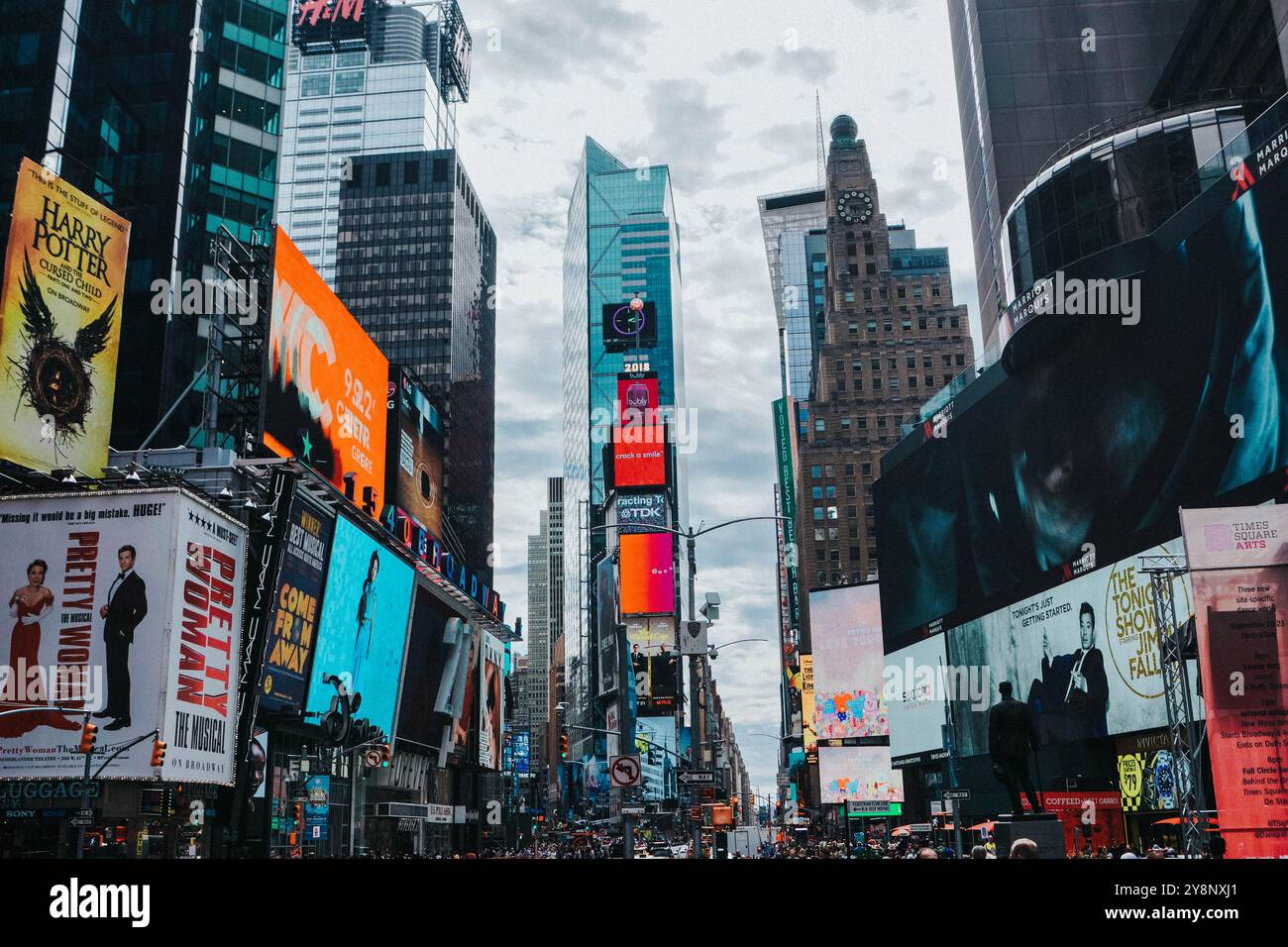 Midtown street in Manhattan district of New York city with skyscrapers ...