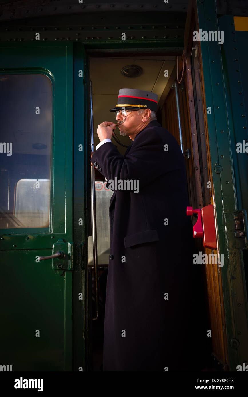 Reenactment scene with authentic 1927 1st class train carriage and a ...