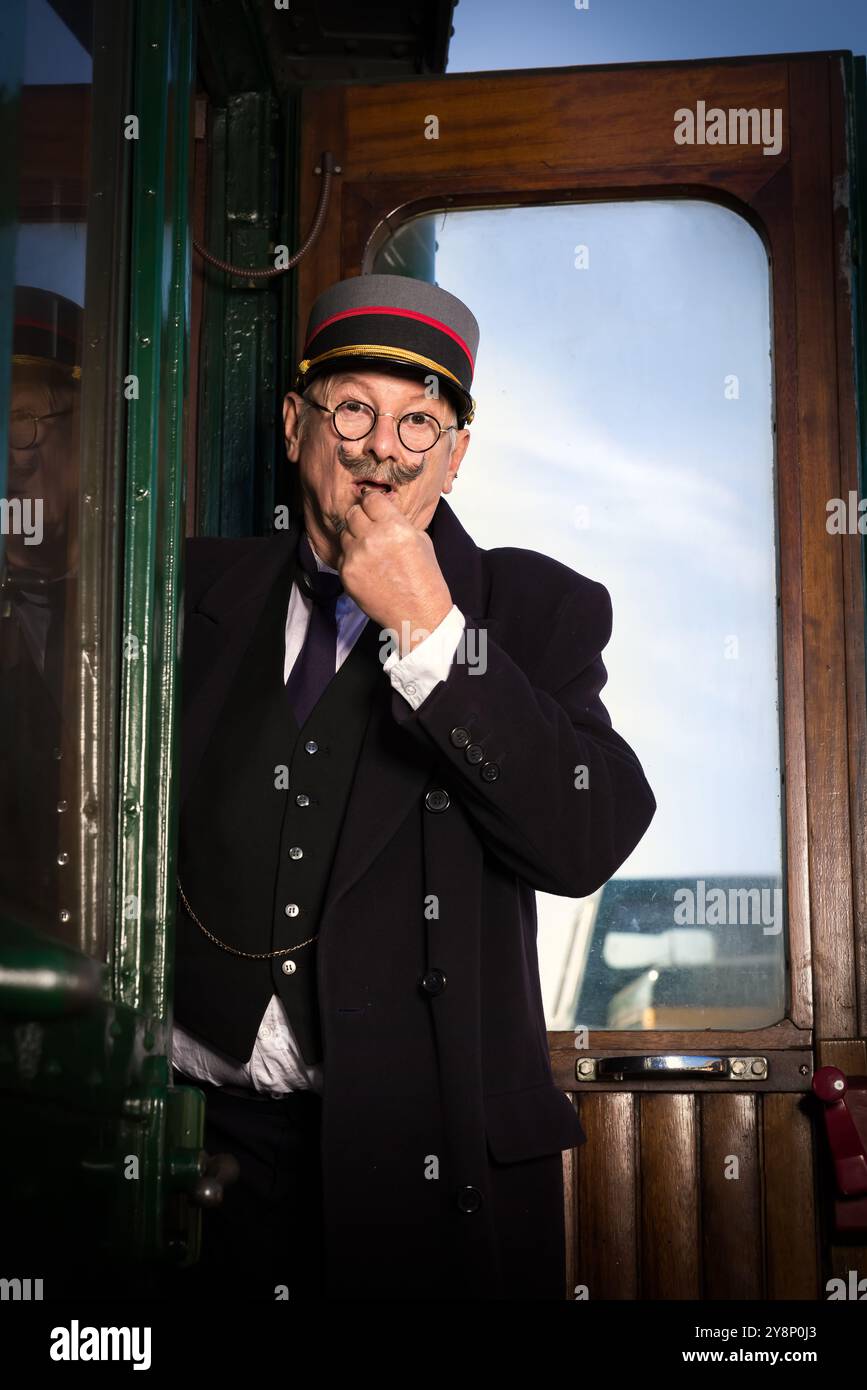 Reenactment scene with authentic 1927 1st class train carriage and a ...