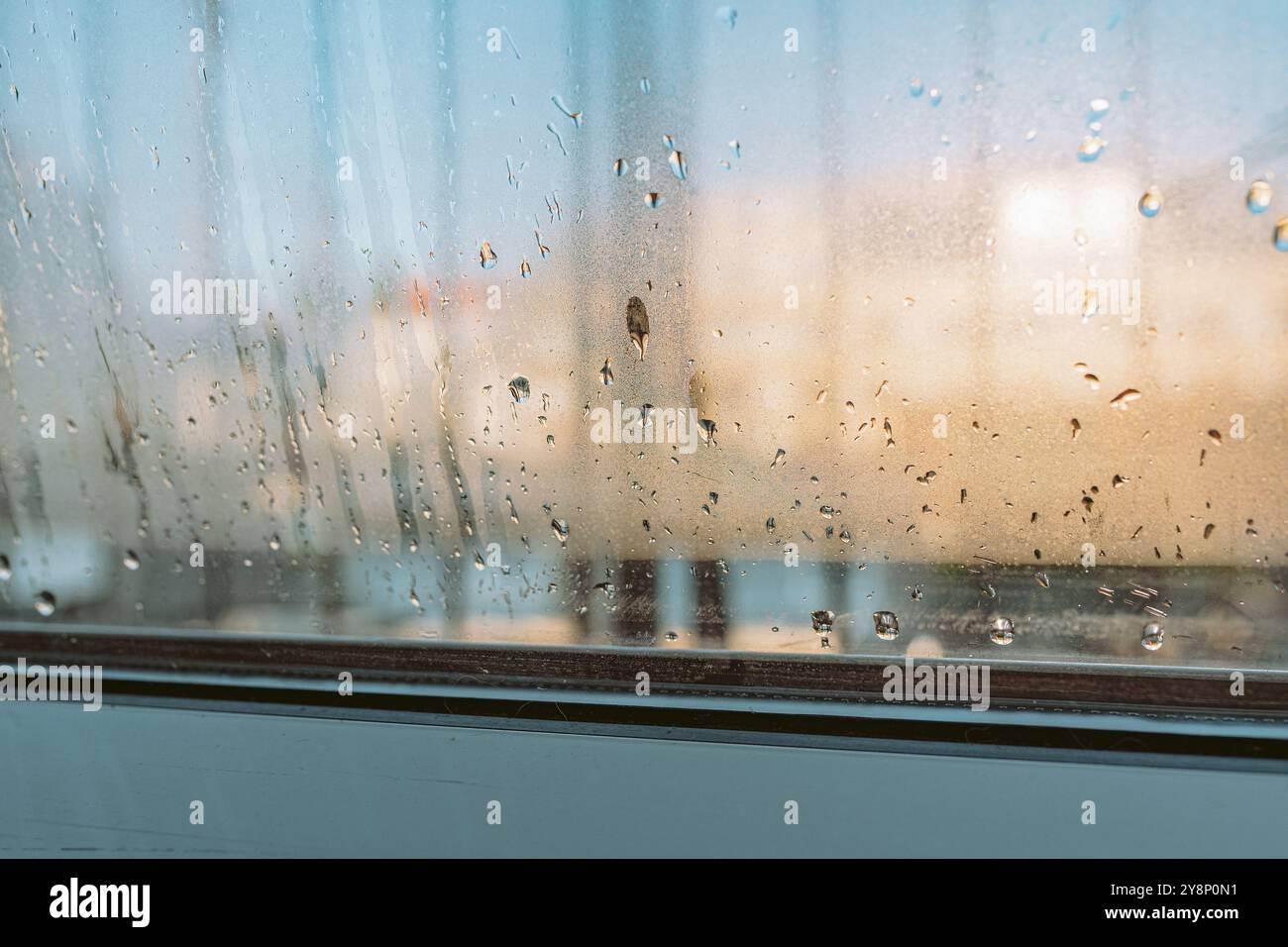 water droplets running on a double glazed window Stock Photo - Alamy