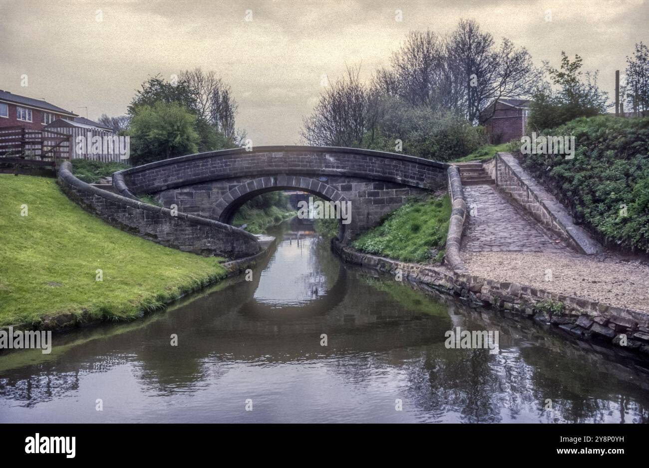 1988 archive photograph of Bridge 76 on the Macclesfield Canal, known ...