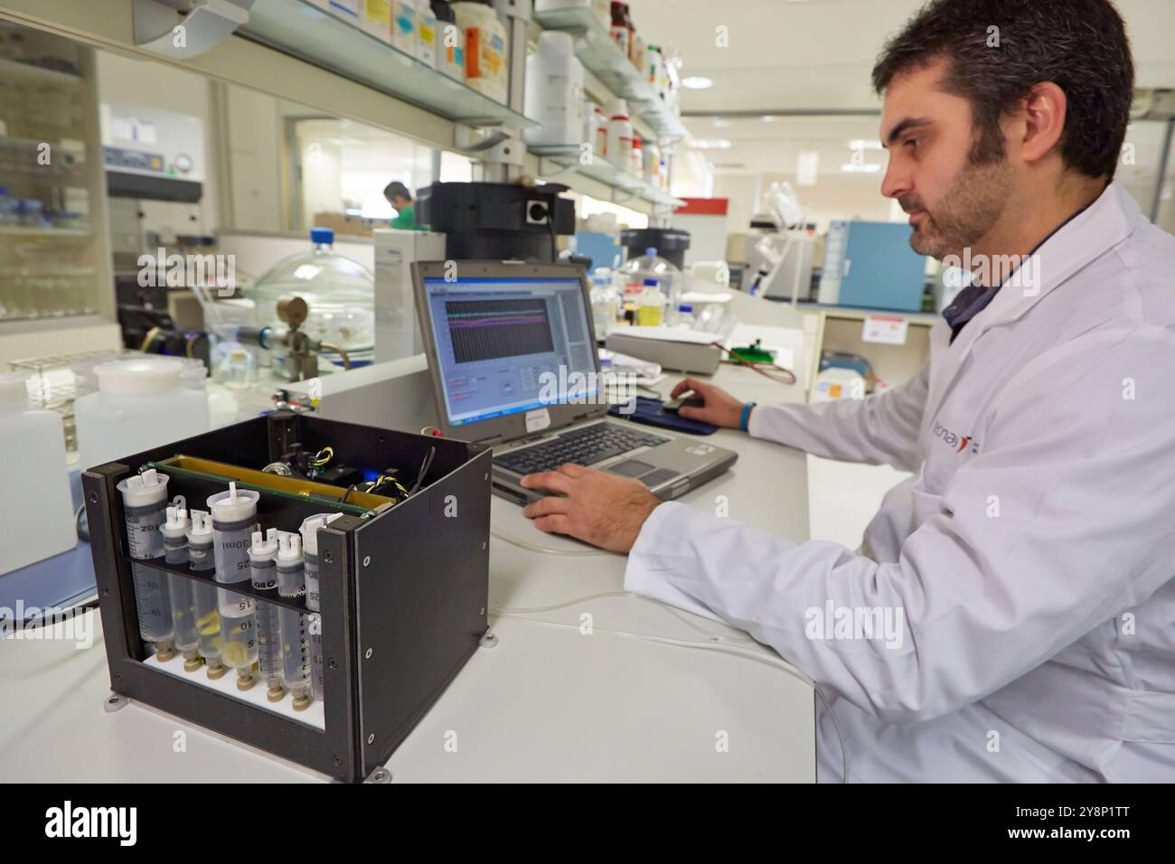 Researcher testing, Immune sensor based on fluorescence polarization ...