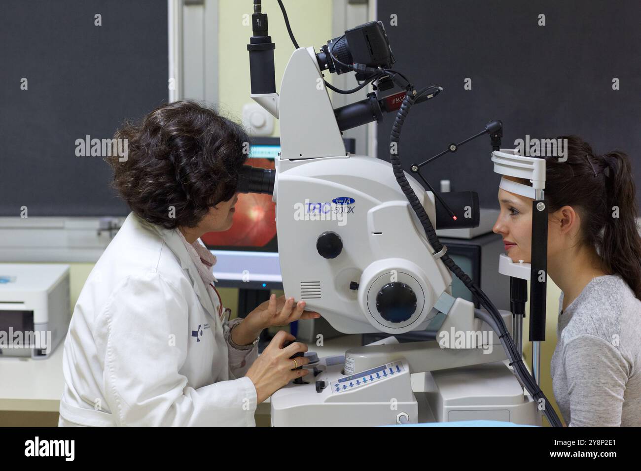 Eye examination Doctor using a retinal camera during an angiography ...
