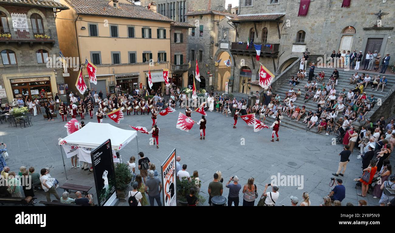 Flag throwers in the main town square in Cortona, Italy. The Archidado ...