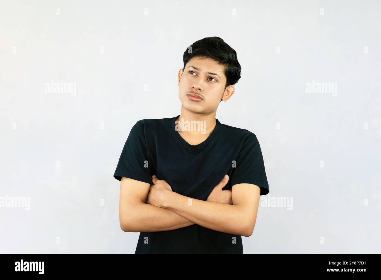 Young Asian Male boy with Black Tshirt points with finder gives ...