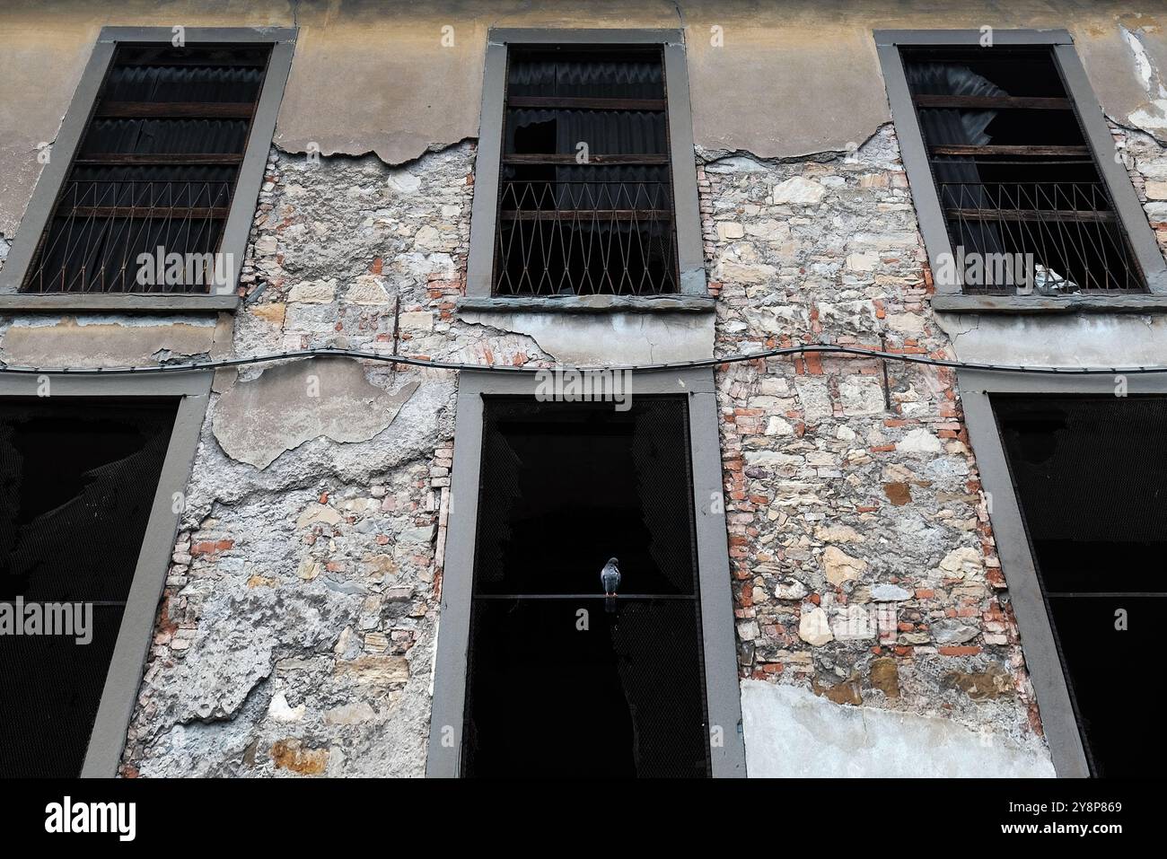 Close up front view of an exterior abandoned building Stock Photo - Alamy
