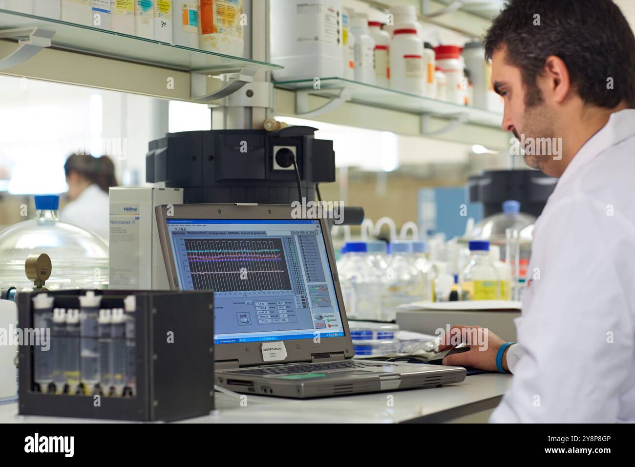 Researcher testing, Immune sensor based on fluorescence polarization ...