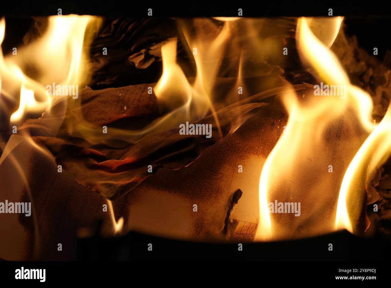 A document burning in flaming fire Stock Photo - Alamy