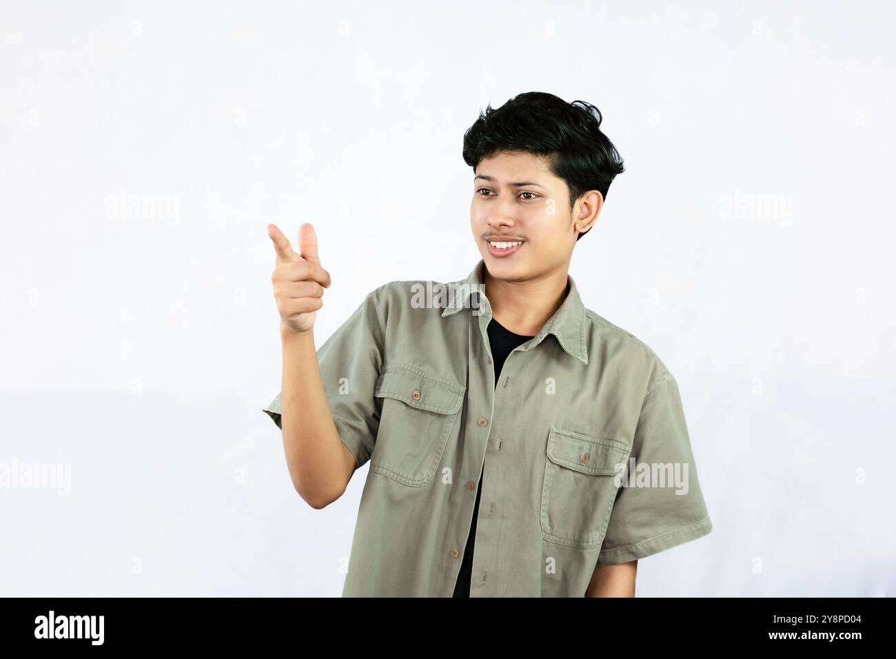 Excited Young Male gives thumbs up finger pointing expressions and ...