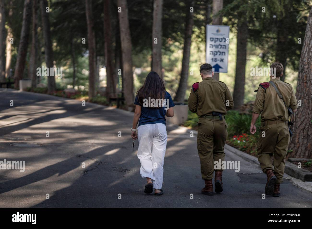 Jerusalem, Israel. 06th Oct, 2024. People walk by a cemetery in ...