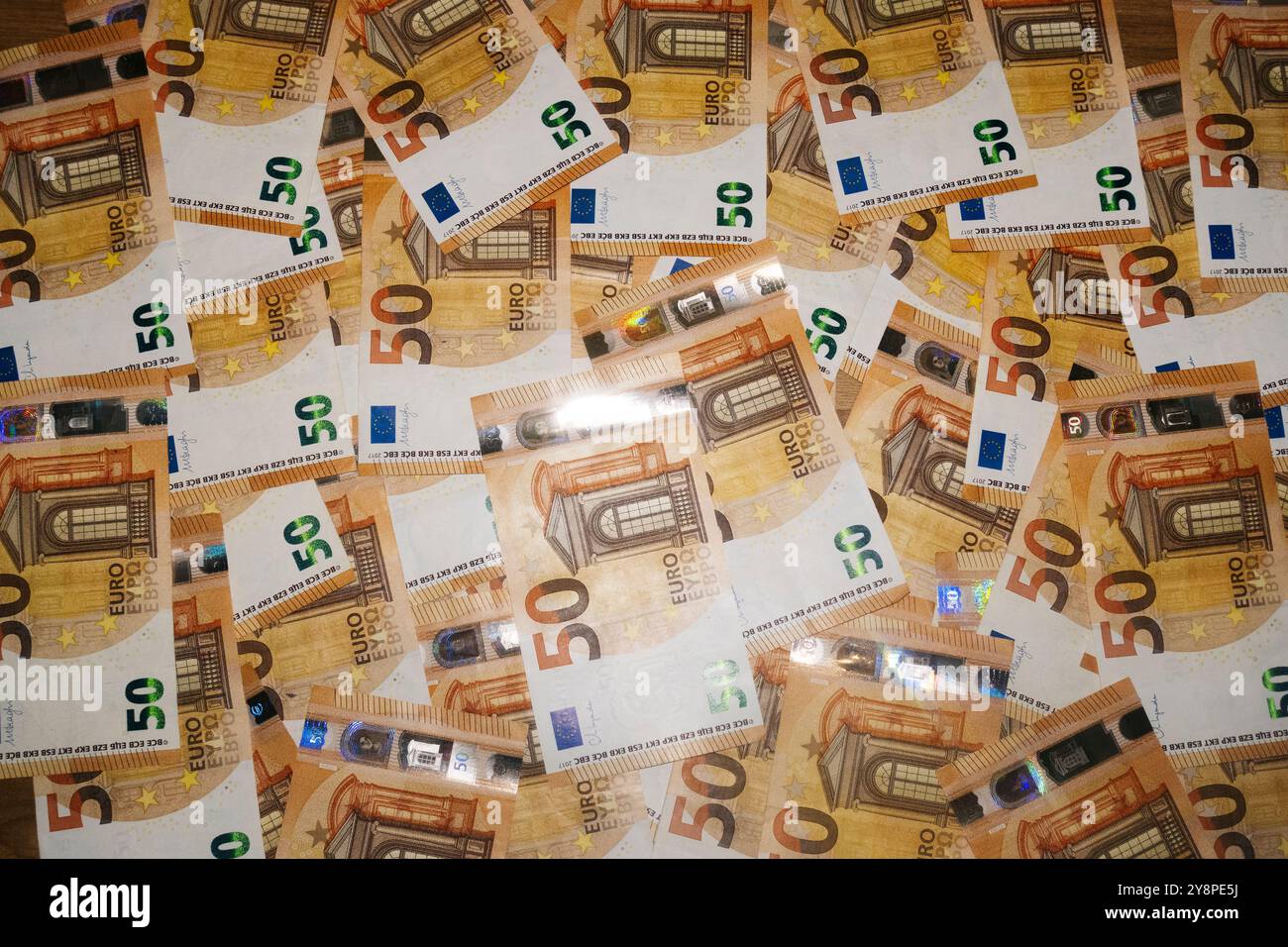 A Background Featuring Stacked Euro Banknotes in Various Denominations ...