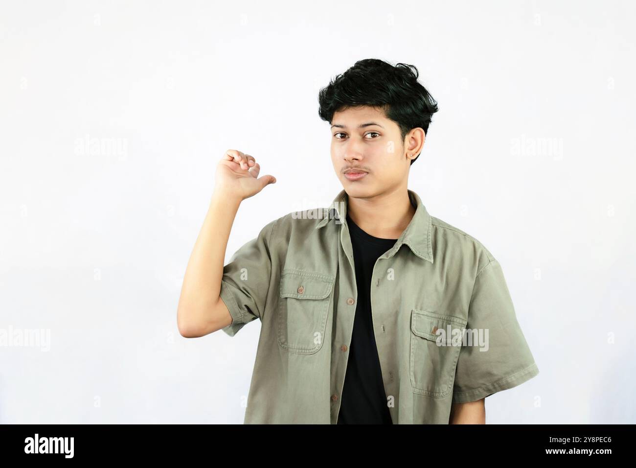 Excited Young Male gives thumbs up finger pointing expressions and ...