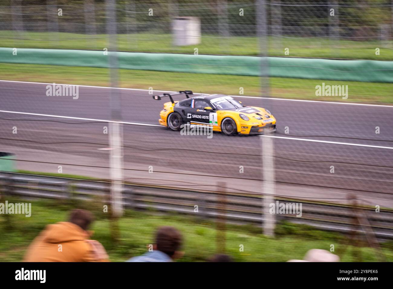 High-Speed Action at Monza Circuit: Dynamic Racing Car Captured in ...