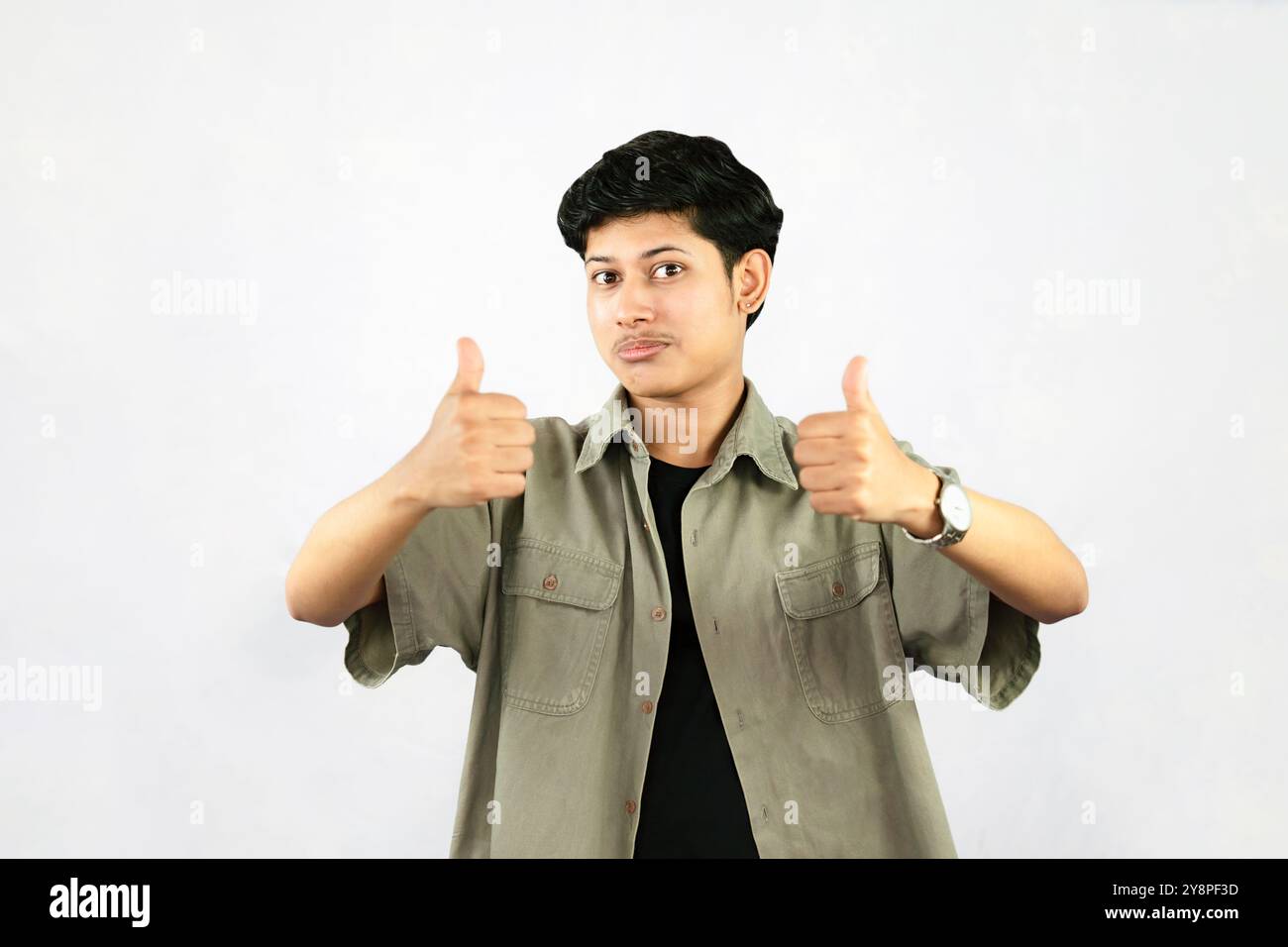 Excited Young Male gives thumbs up finger pointing expressions and ...