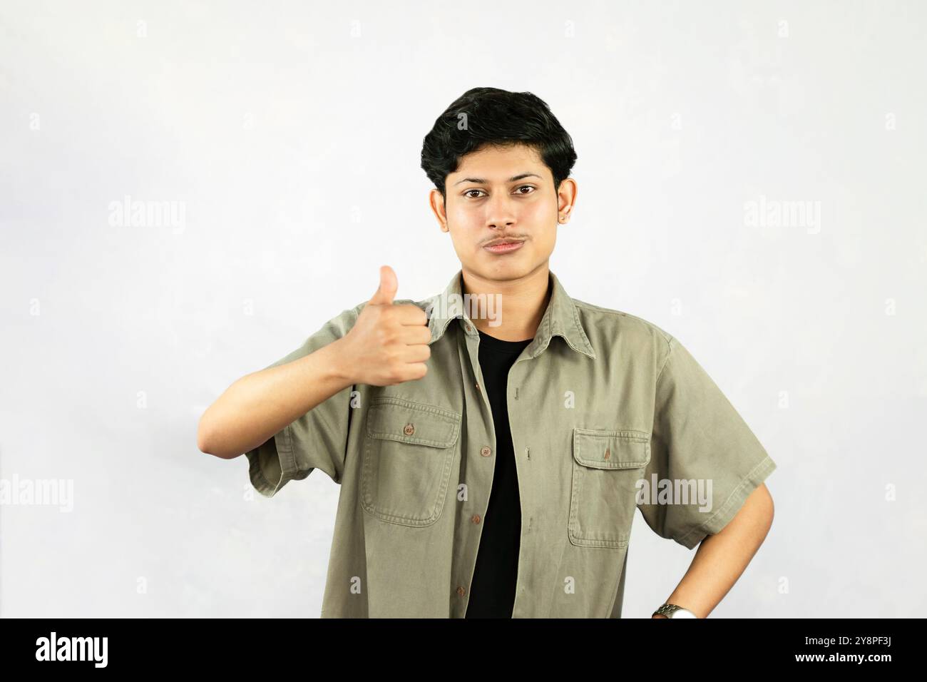 Excited Young Male gives thumbs up finger pointing expressions and ...