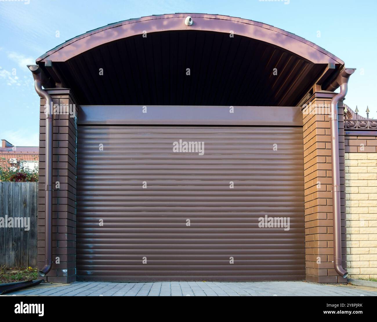 Rolling overhead gates garage canopies Stock Photo - Alamy
