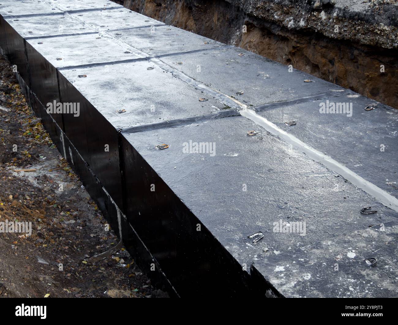 Concrete box for underground communications covered with waterproofing ...