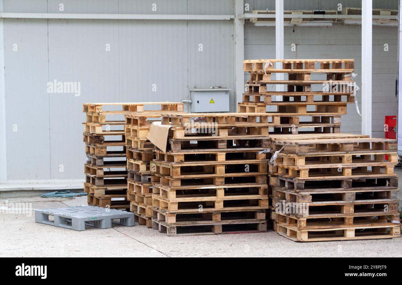 A visually appealing arrangement of stacked wooden pallets in multiple ...