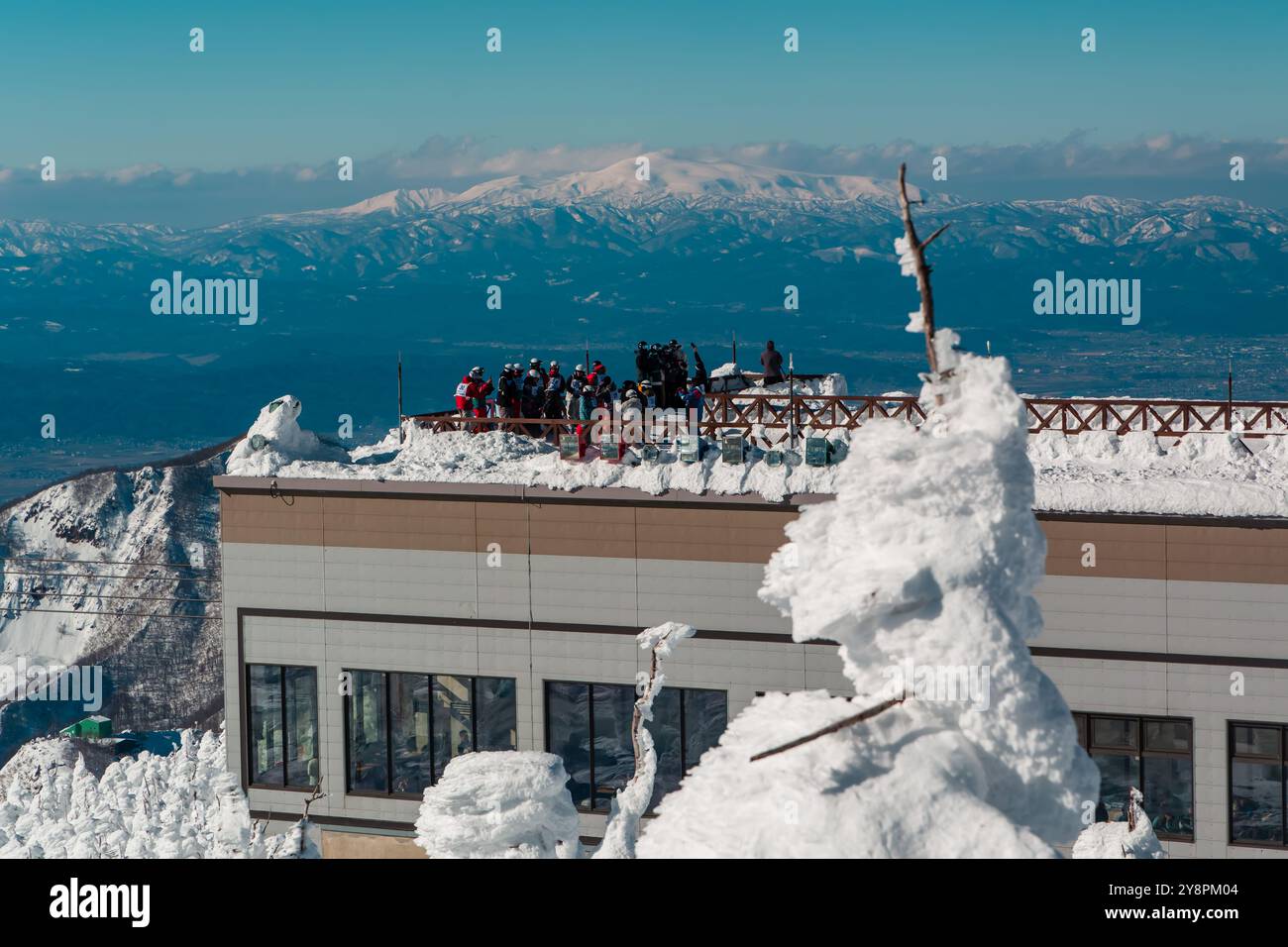 Tourists on the rooftop viewpoint of the ropeway station amongst the ...