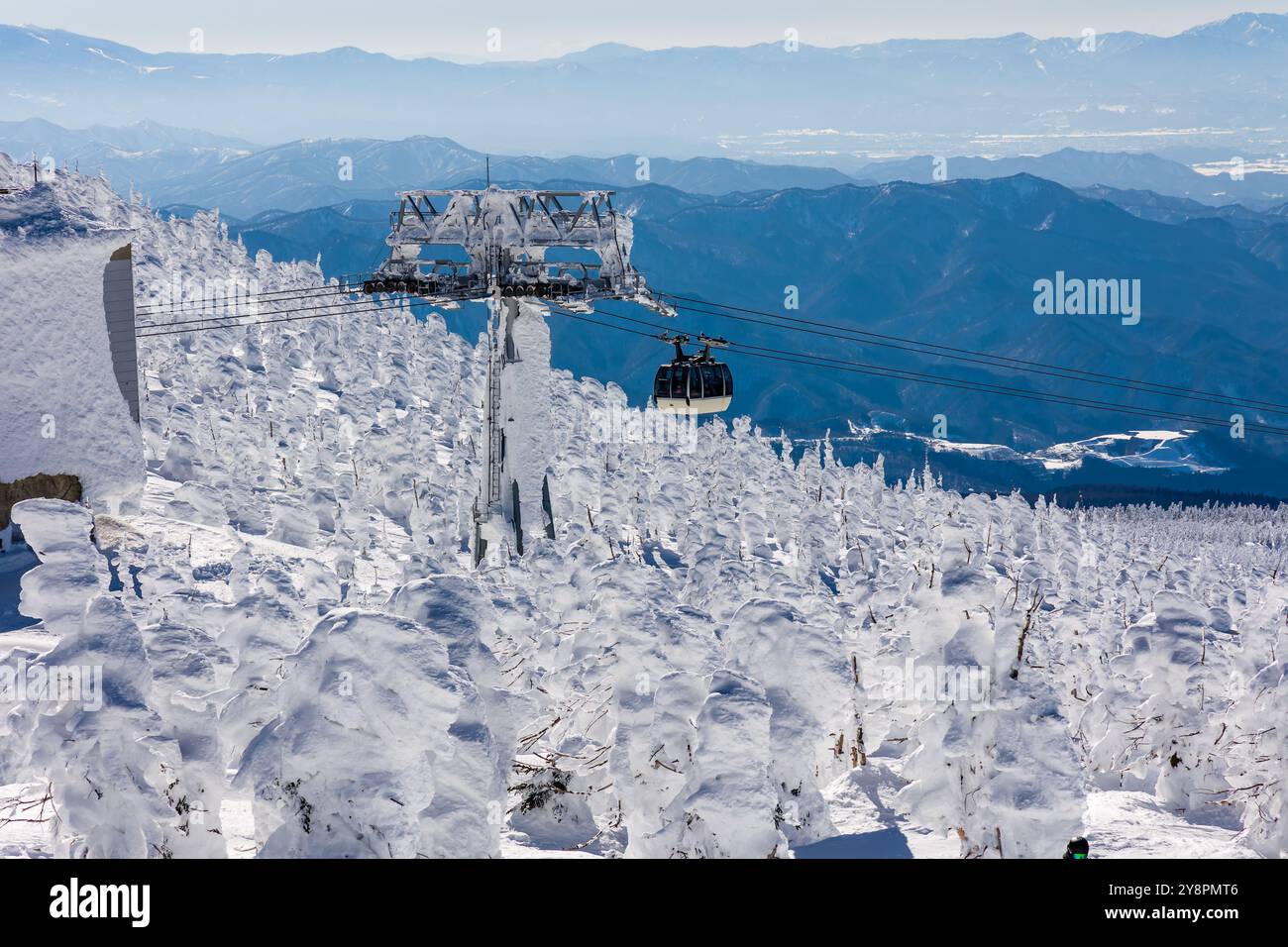 Gondola and ropeway above snow and ice frozen "snow monsters" at Zao ...