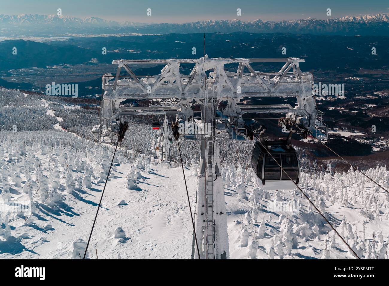Gondola and ropeway above snow and ice frozen "snow monsters" at Zao ...