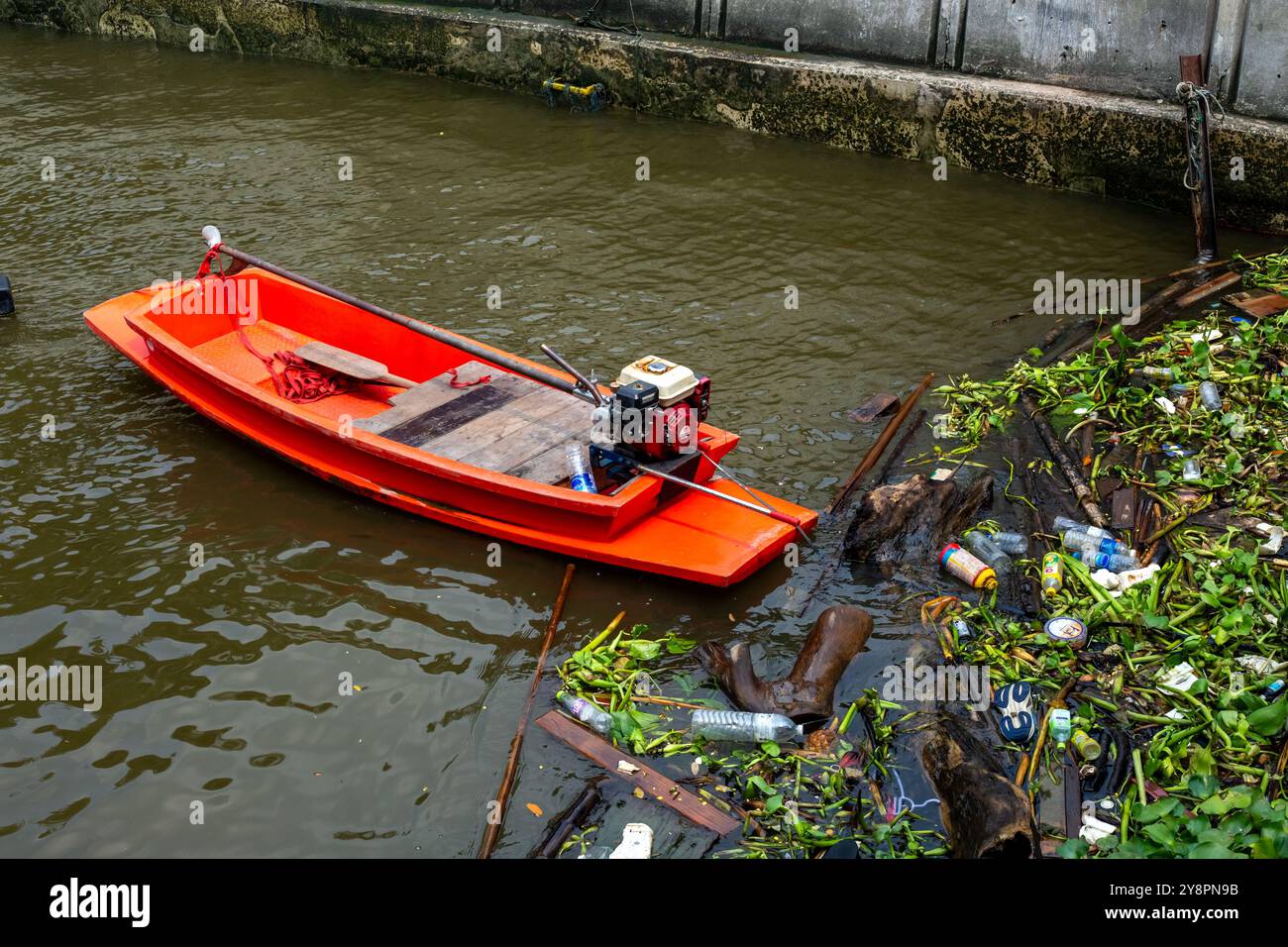 World Water Pollution Problem. boat in dirty water in river canal with ...