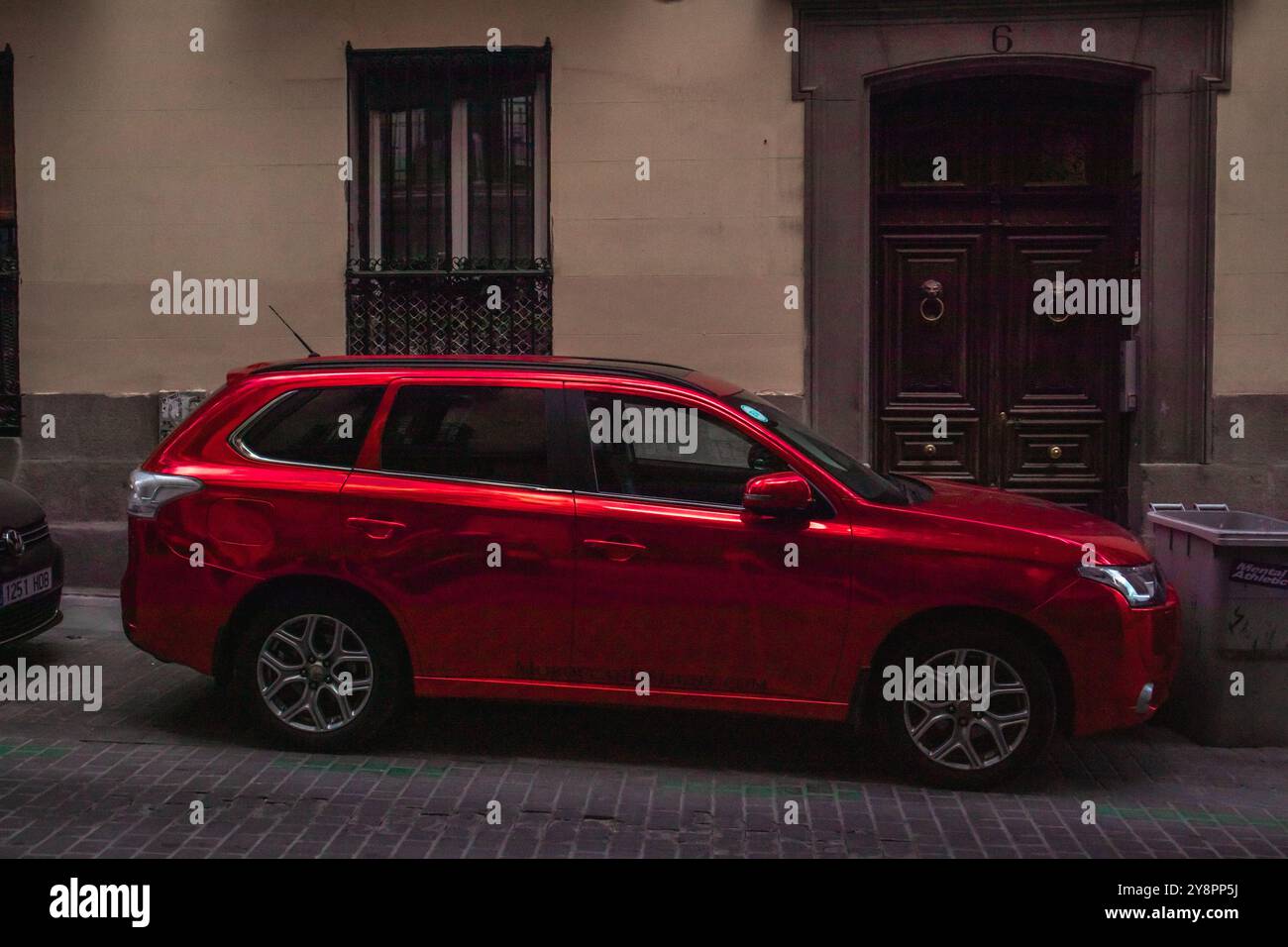 Madrid, Spain. July 20, 2024 A red luxury shiny expensive SUV car is ...