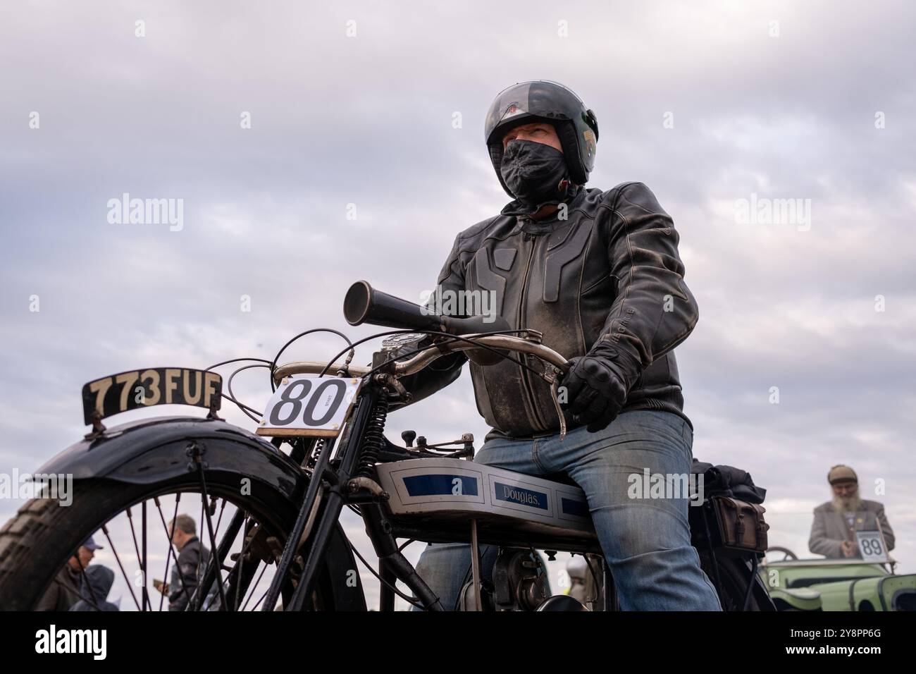 Epsom, UK. 06th Oct, 2024. A veteran motorcycle rider sits on his ...