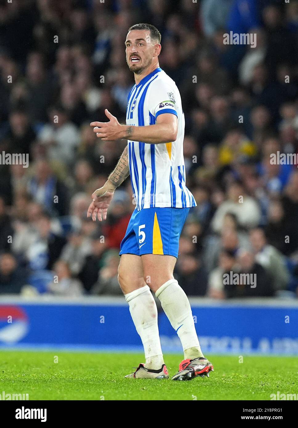 Brighton and Hove Albion's Lewis Dunk celebrates victory in the Premier ...