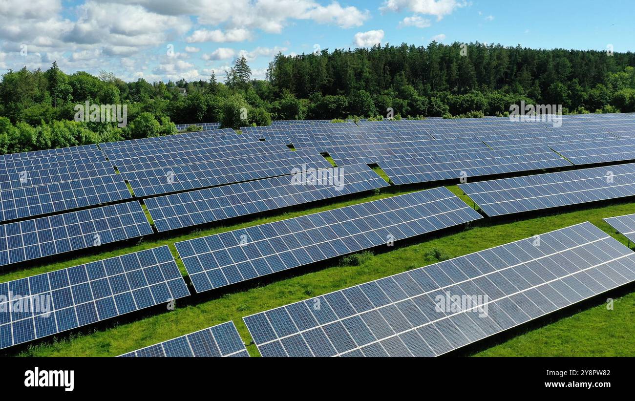 This stunning aerial view captures an expansive solar field, showcasing ...