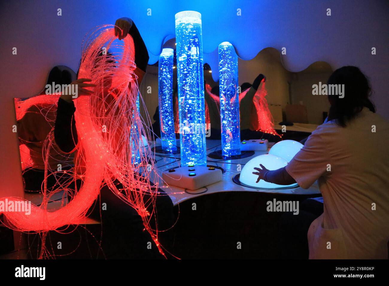 Snoezelen space with a patient and a nurse in a mental health facility ...